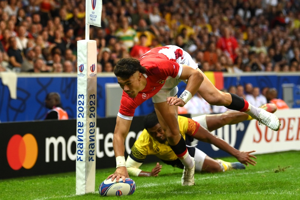 Seven-try Tonga bow out with World Cup win over Romania
